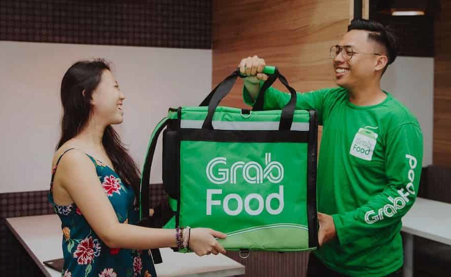 [Updated] Strong growth in deliveries helps Grab narrow net loss to ...